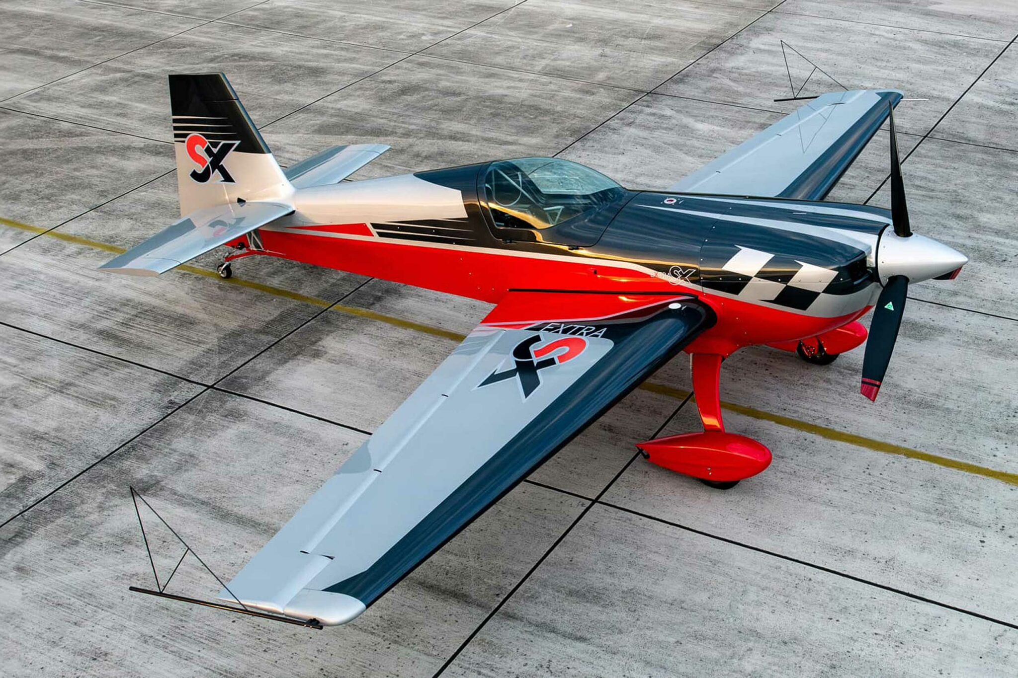 Extra shows off new 330SX aerobatic star : : FLYER